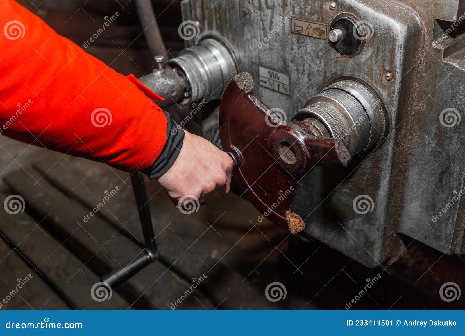 The Hand of a Man in a Red Work Suit, Holds on To the Handle and ...