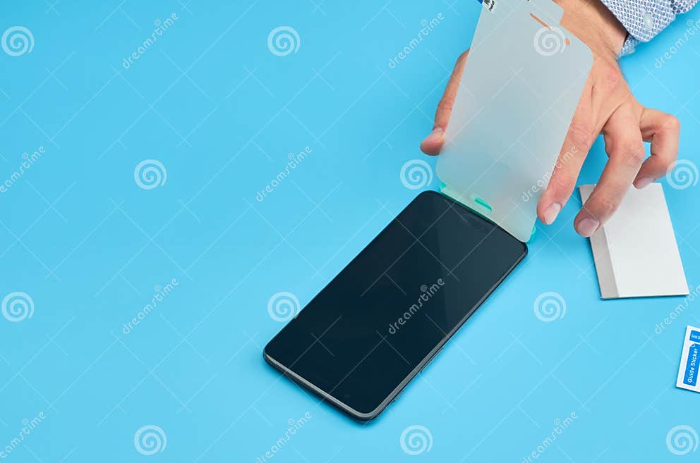The Man Replacing the Broken Tempered Glass Screen Protector for ...