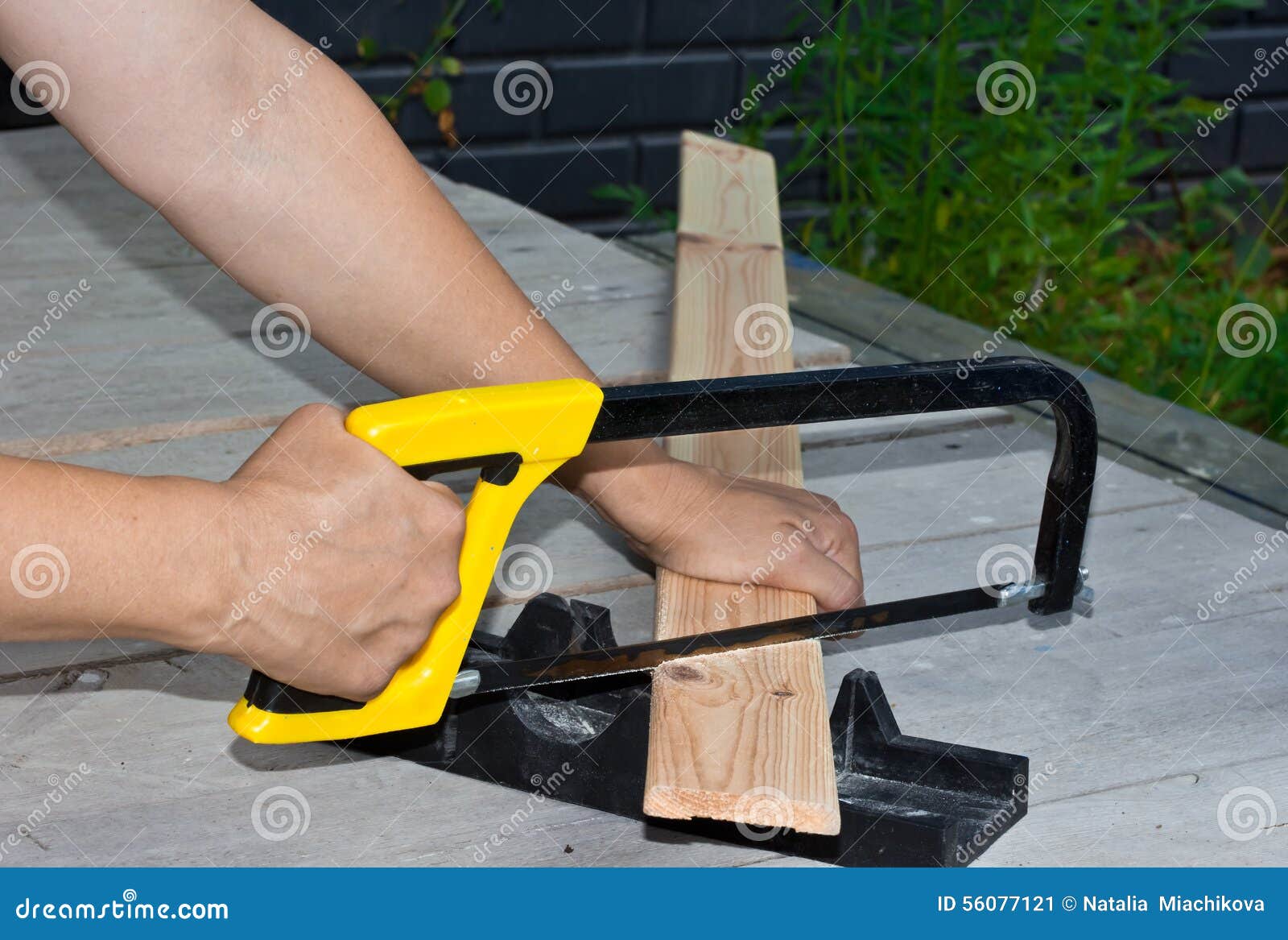 Hand man saws a board saw stock image. Image of floor - 56077121