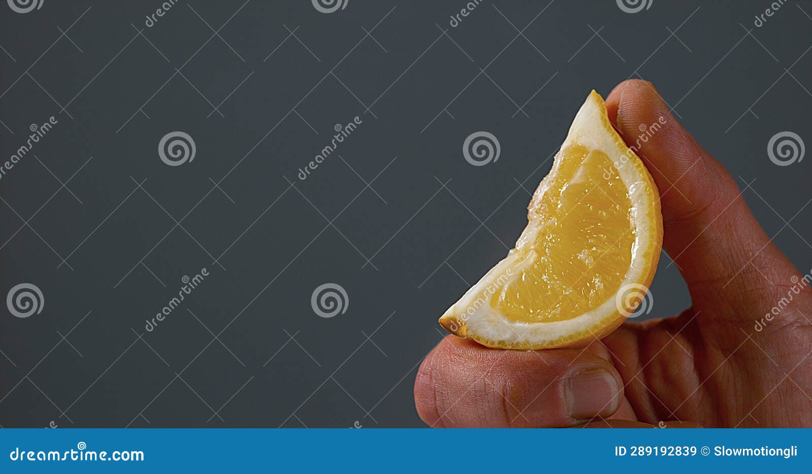 Hand of Man Squeezing Lemon, Citrus Limonum Against Black Background ...