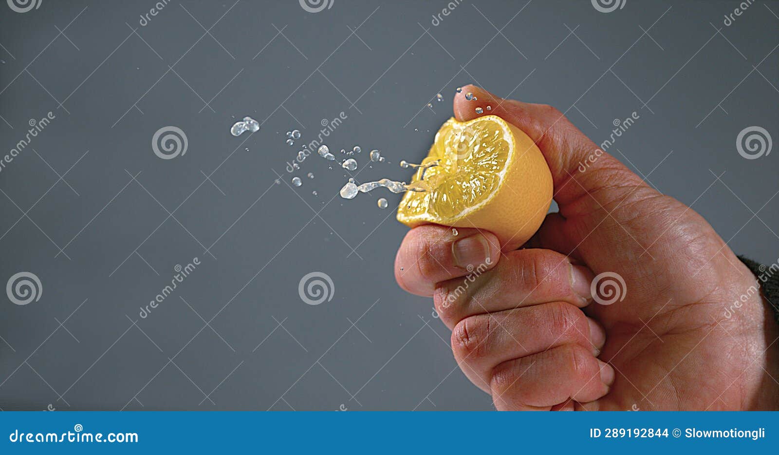 Hand of Man Squeezing Lemon, Citrus Limonum Against Black Background ...