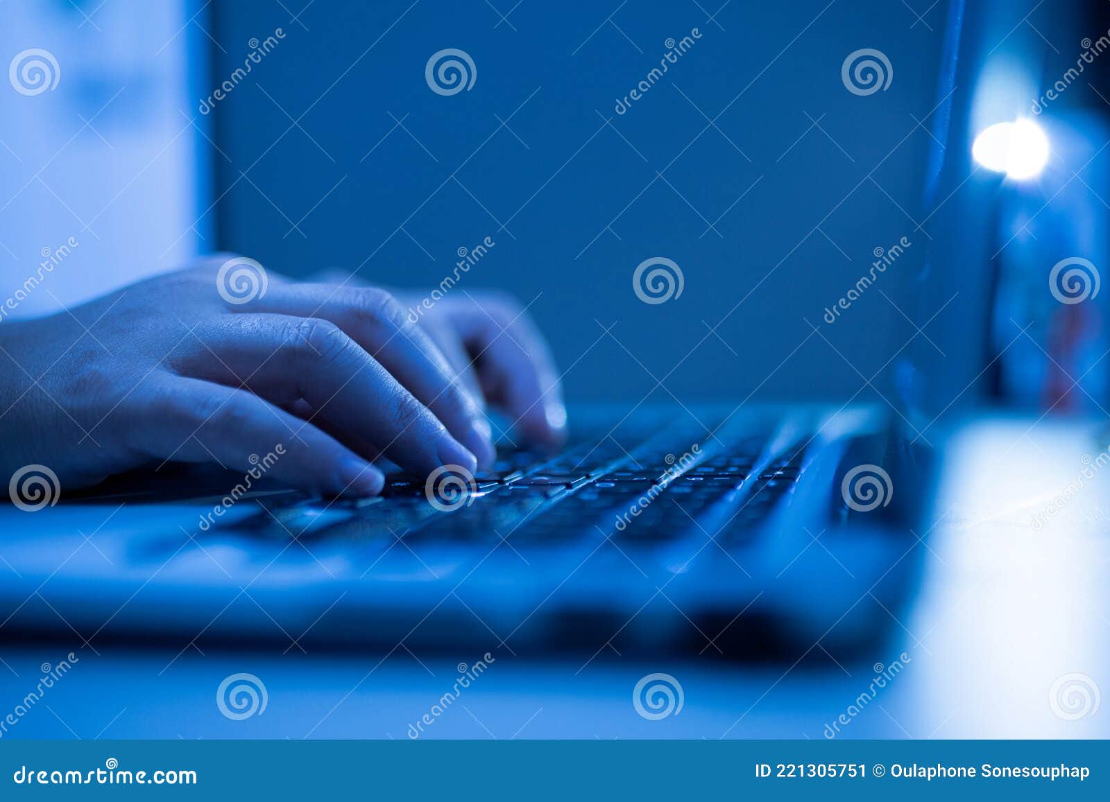 Hand of a Man Using Laptop Computer for Hacking or Steal Data at Night ...
