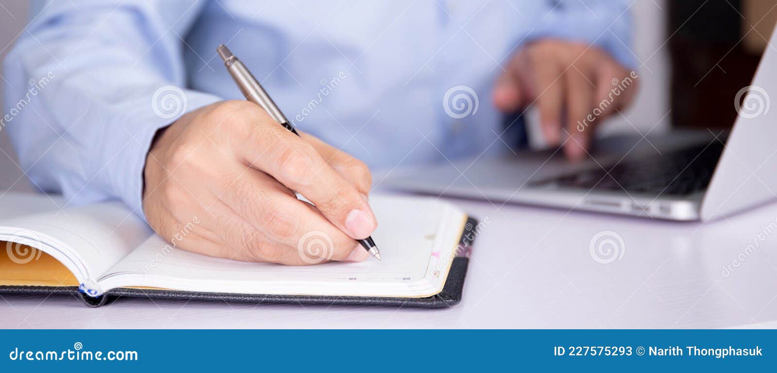 Hand of Man Watching Webinar on Laptop Computer and Writing on Notebook ...