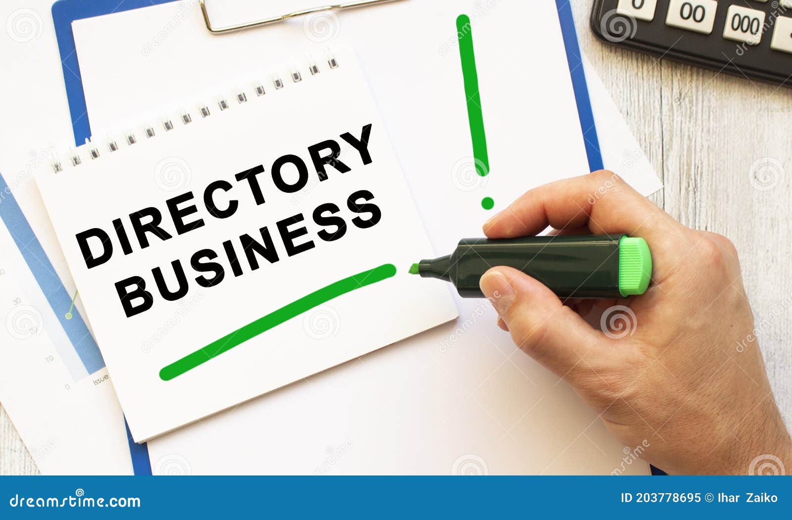 A Hand with a Marker Writes the Text DIRECTORY BUSINESS in a Notebook ...
