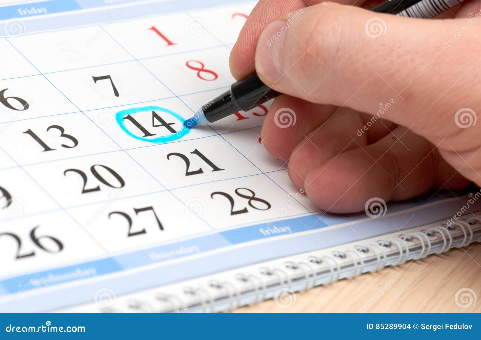 Hand Marks Date in the Calendar in Blue Stock Photo - Image of ...