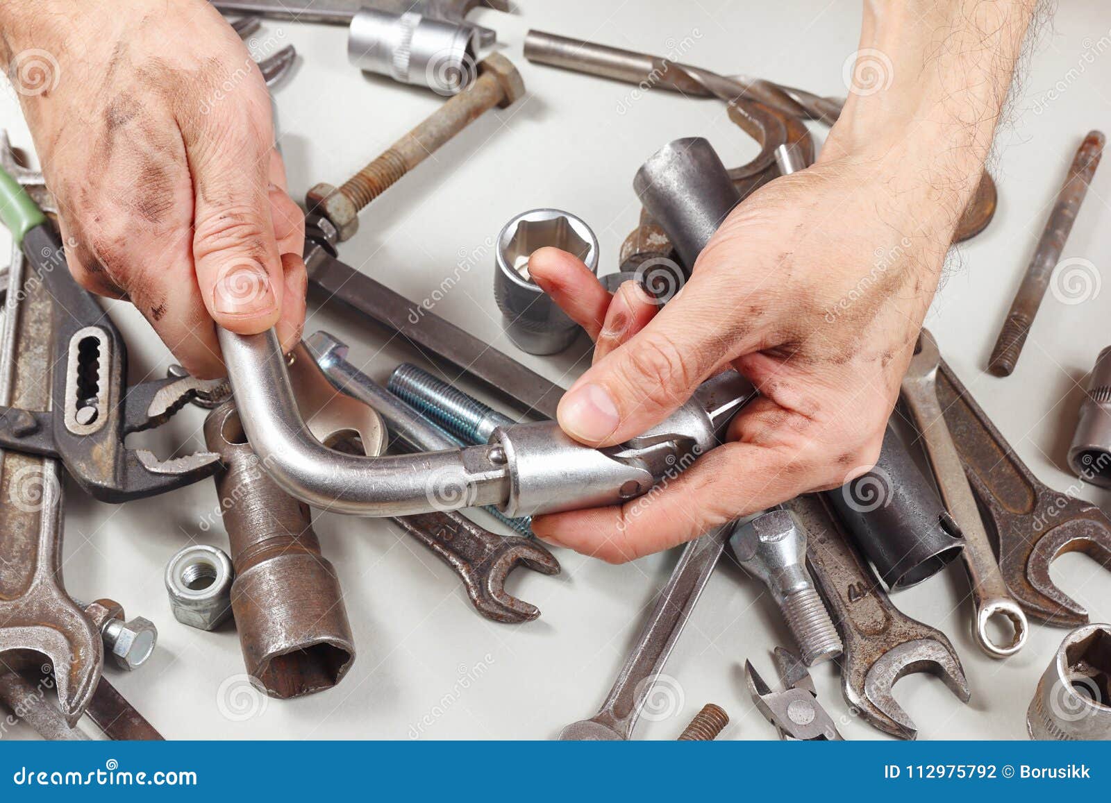 Hand of Master Repairing Parts of Mechanism in the Workshop Stock Photo ...