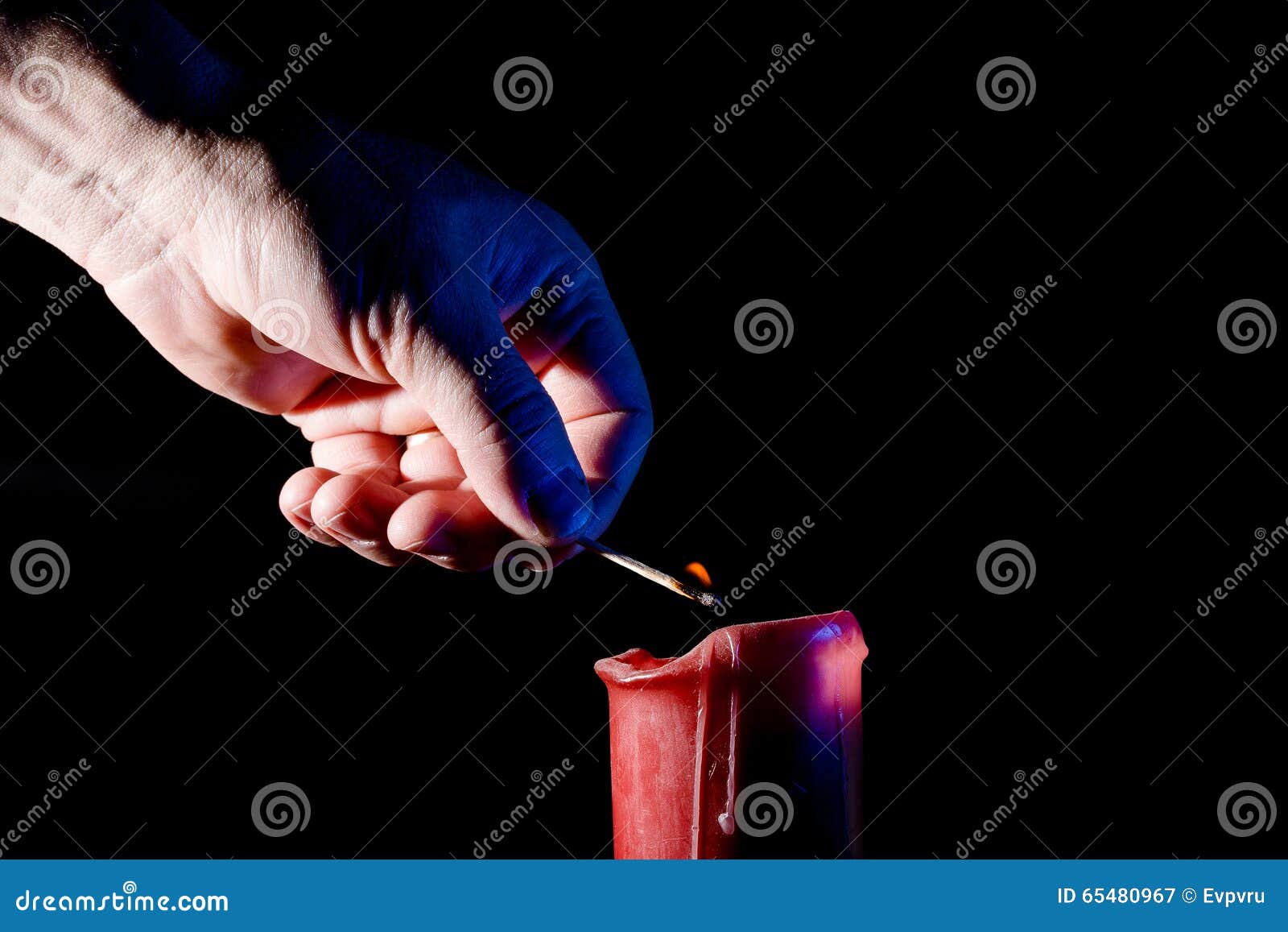 Hand with a Match Lights a Red Candle Stock Image - Image of burn, dark ...