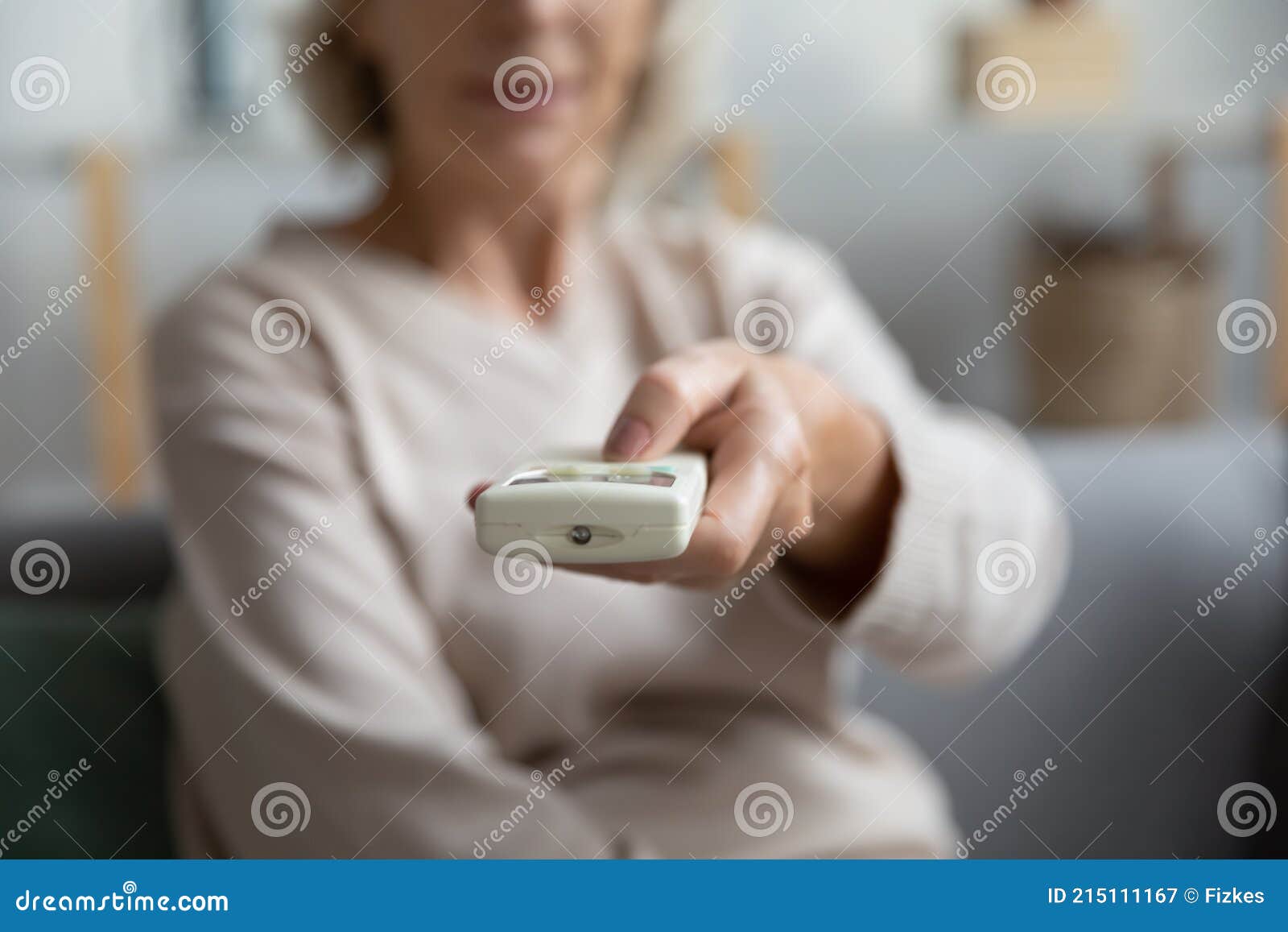 Hand of Mature Lady Operating Remote Controller Stock Image - Image of ...