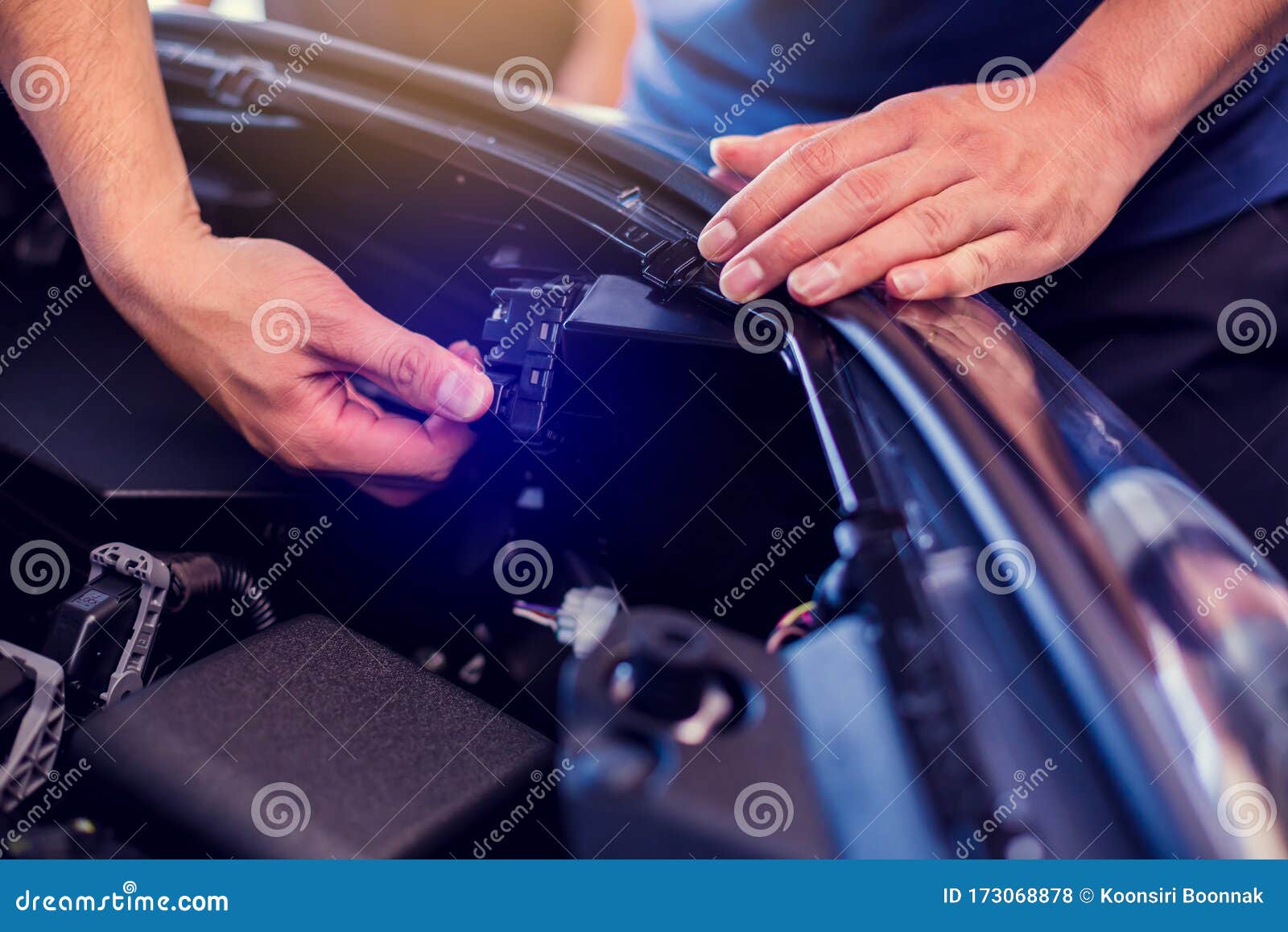 The Hand of a Mechanic is Checking the Connectors of Car Engine ...