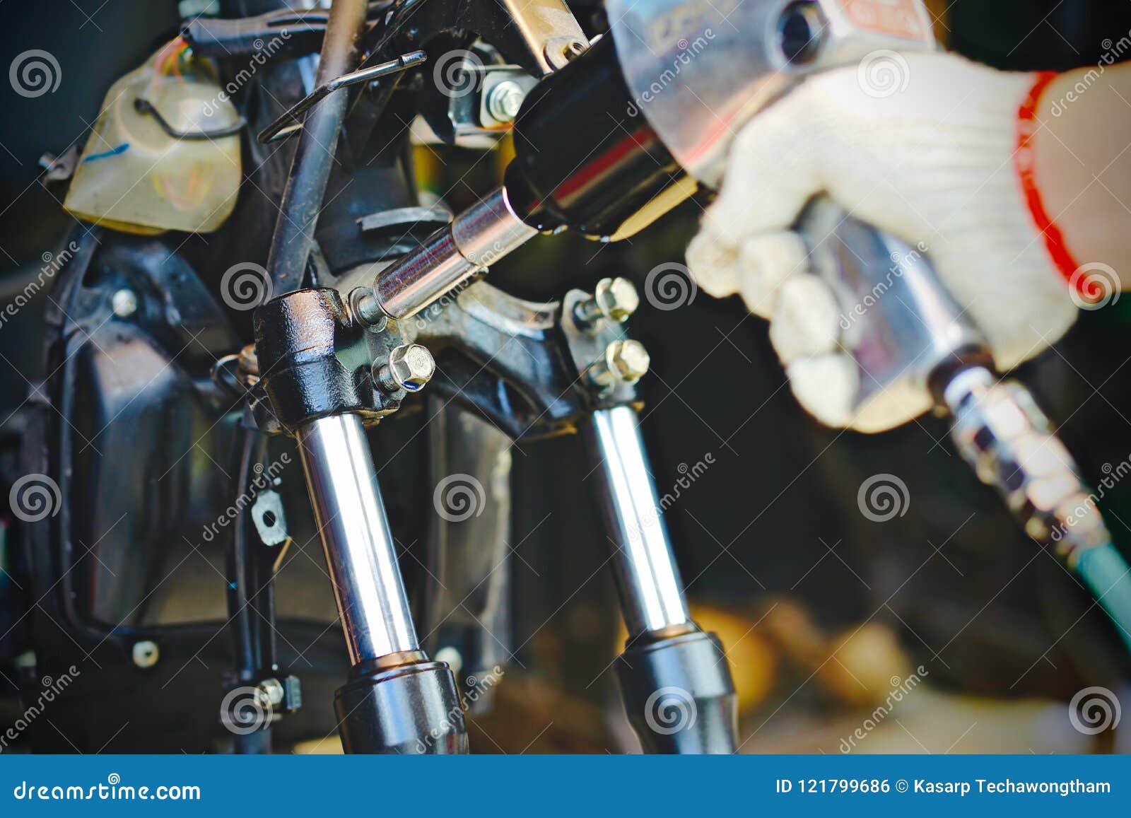 Hand of Mechanic Man Replace and Adjust Motorcycle Rear Brake System ...