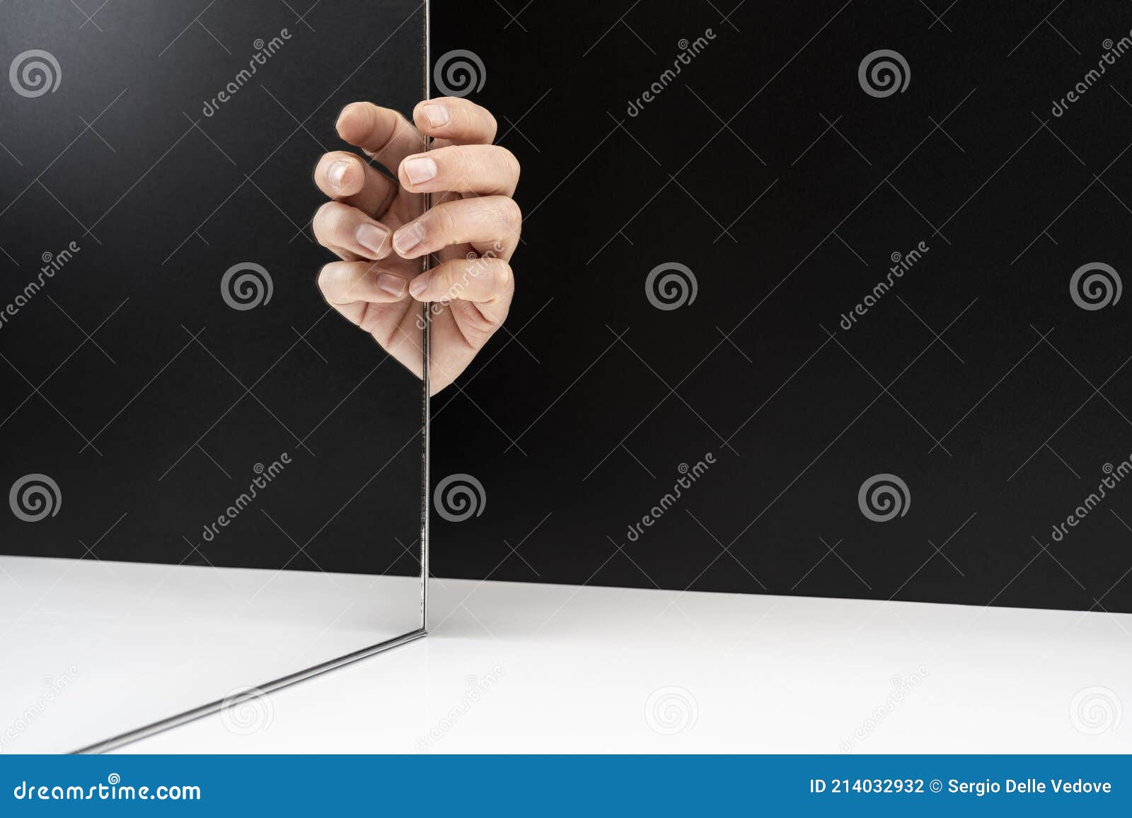 The hand on the mirror stock photo. Image of touch, hidden - 214032932