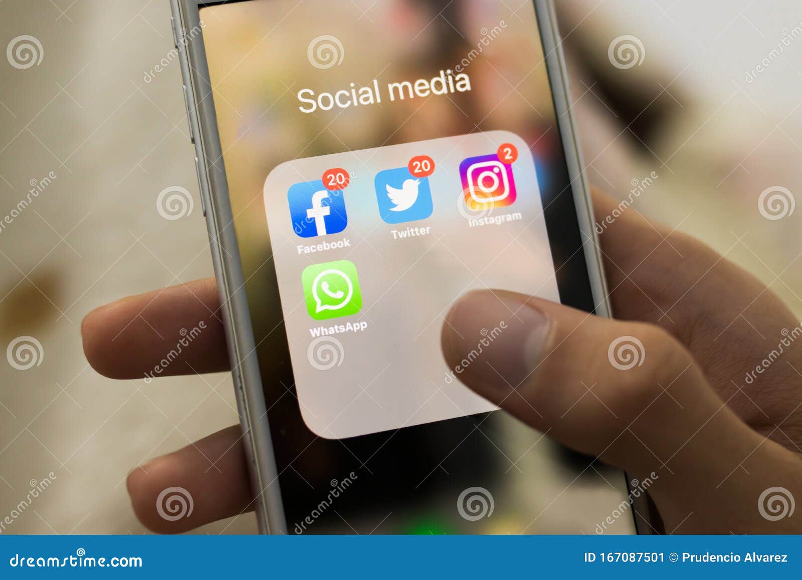 Hand with Mobile Phone and Social Media Applications on Screen ... Hand with Mobile Phone and Social Media Applications on Screen ...