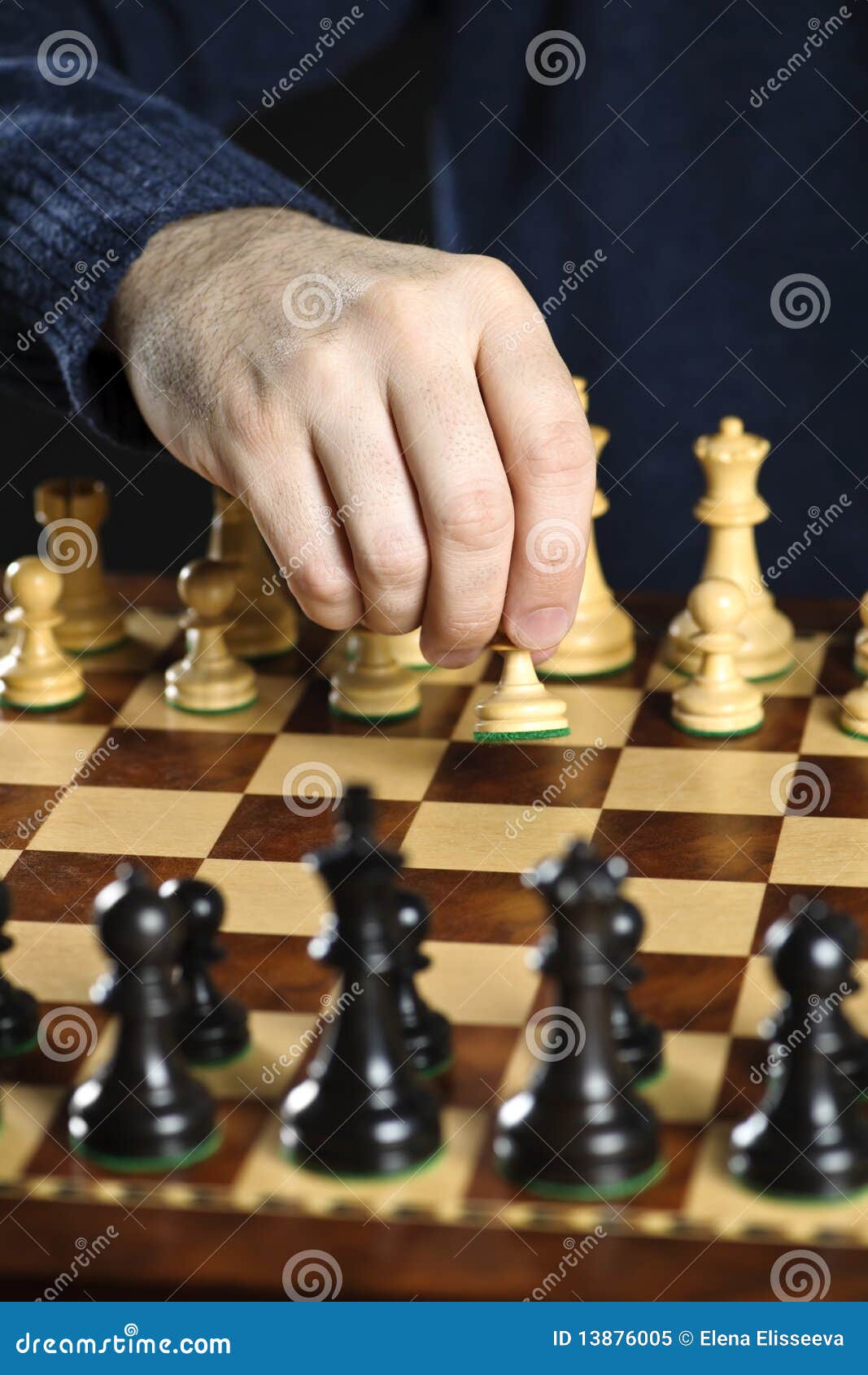 Hand Playing Chess