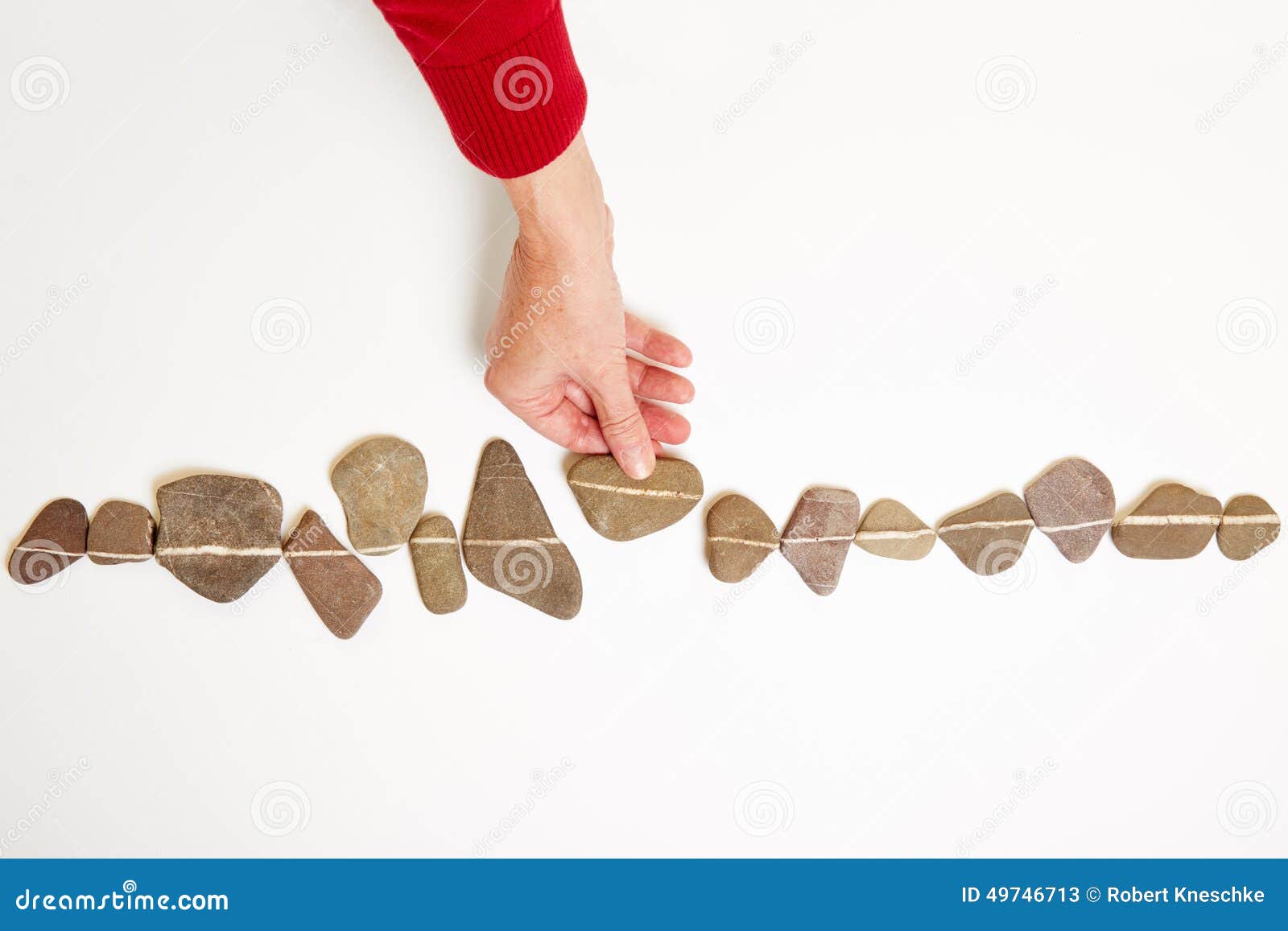 Hand moving stone in line stock image. Image of pebble - 49746713