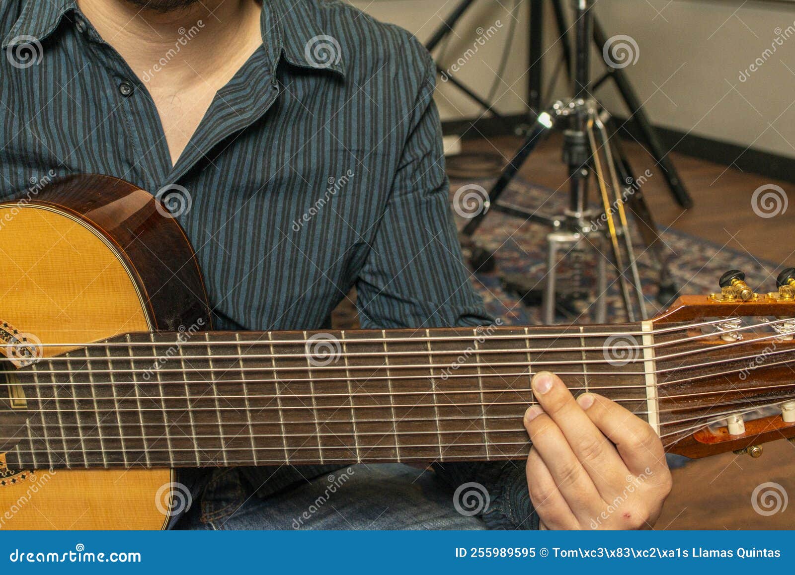 Hand of a Musician Playing a Fret with Eight Strings Stock Image ...