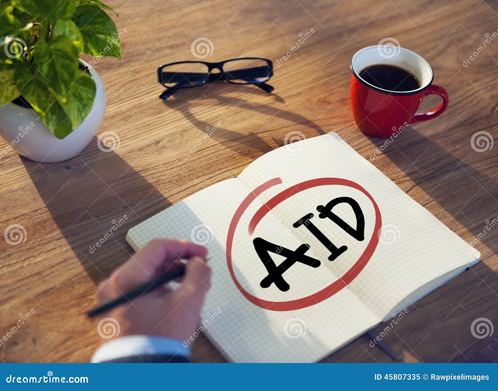 Hand with a Note and a Single Word AID Stock Image - Image of pencil ...