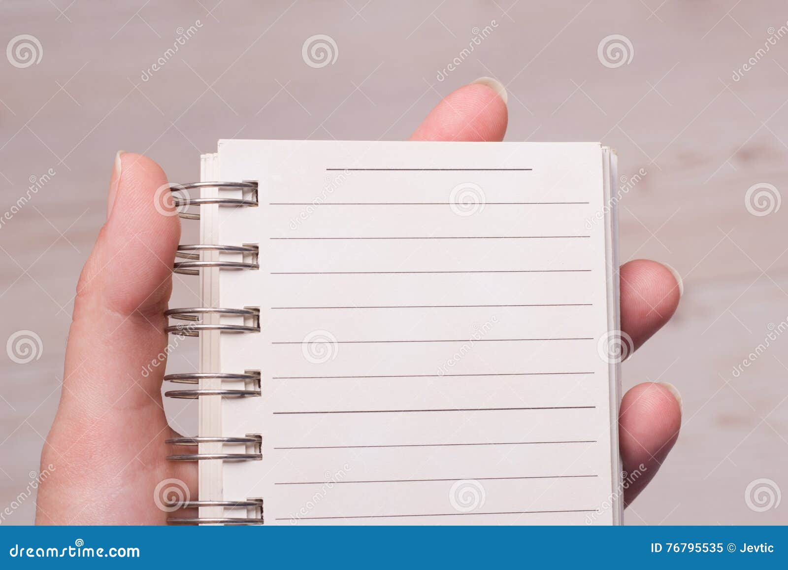 Hand with notebook stock image. Image of paper, close - 76795535