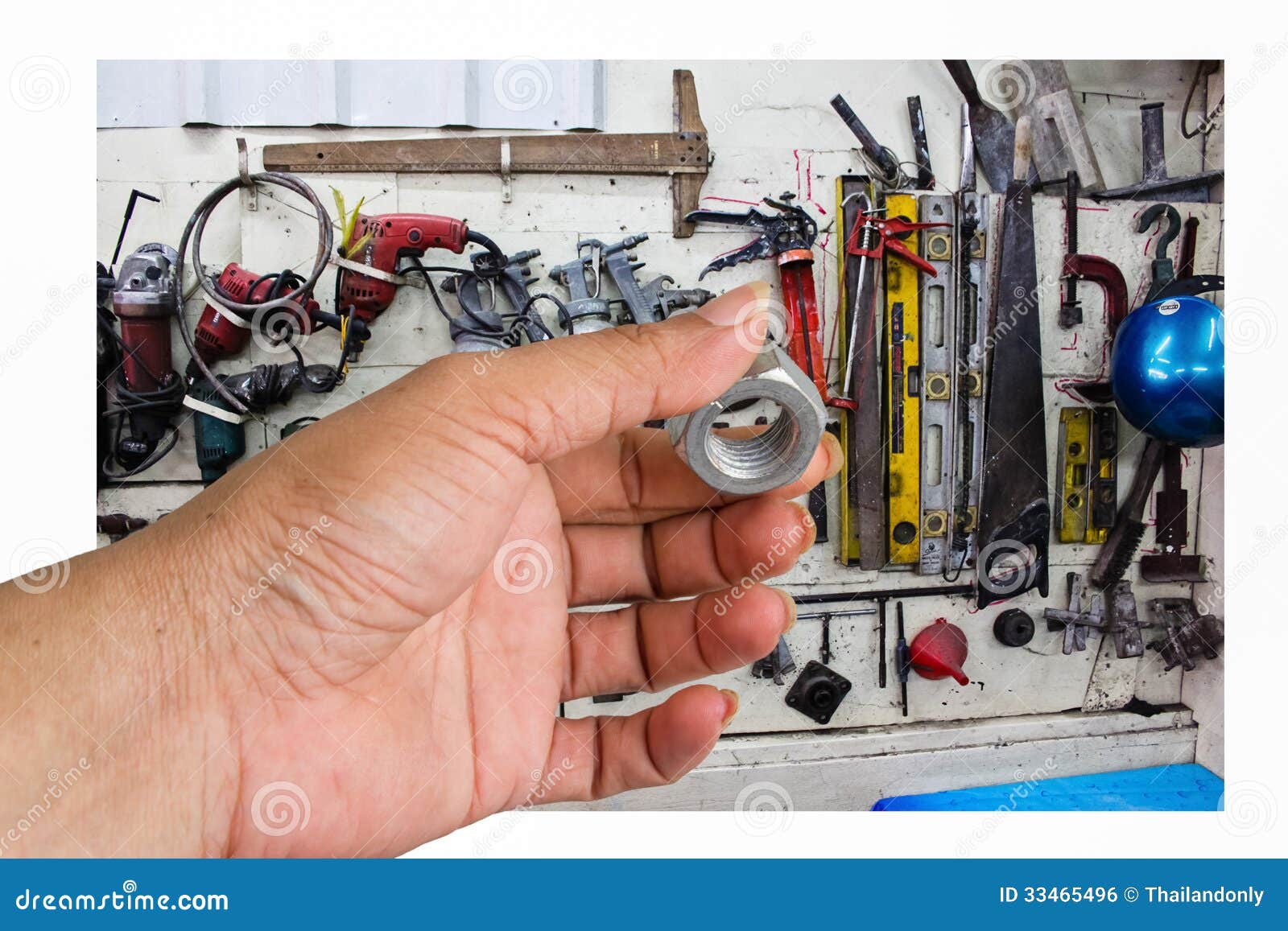 Hand with Nuts and Bolts stock photo. Image of metal - 33465496