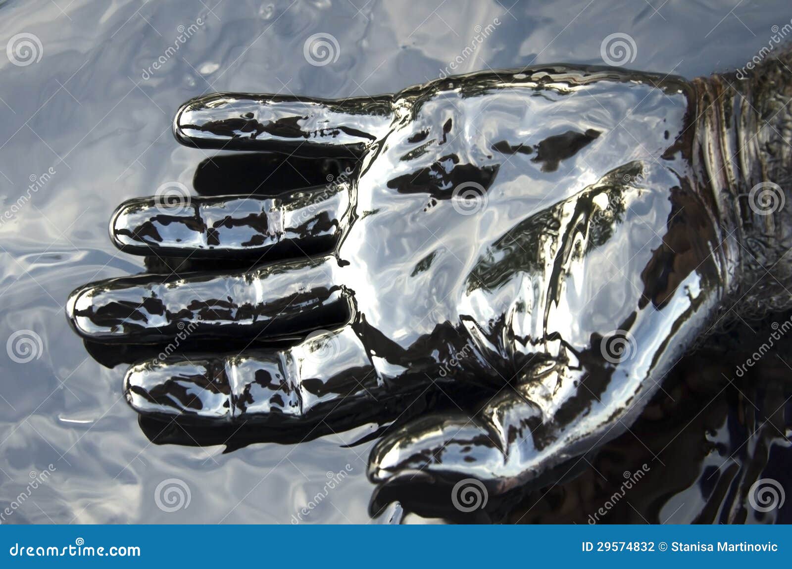 Hand in oil spill stock photo. Image of waste, danger - 29574832