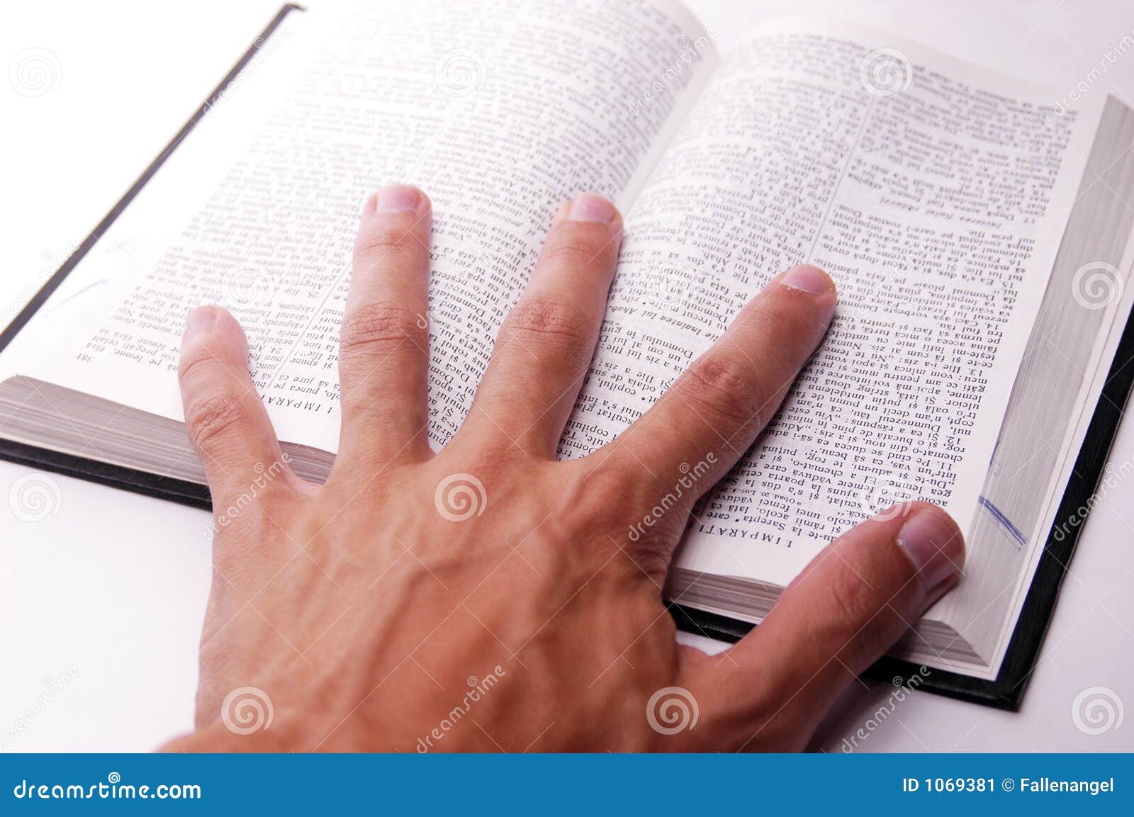Hand on open book stock image. Image of library, bible - 1069381