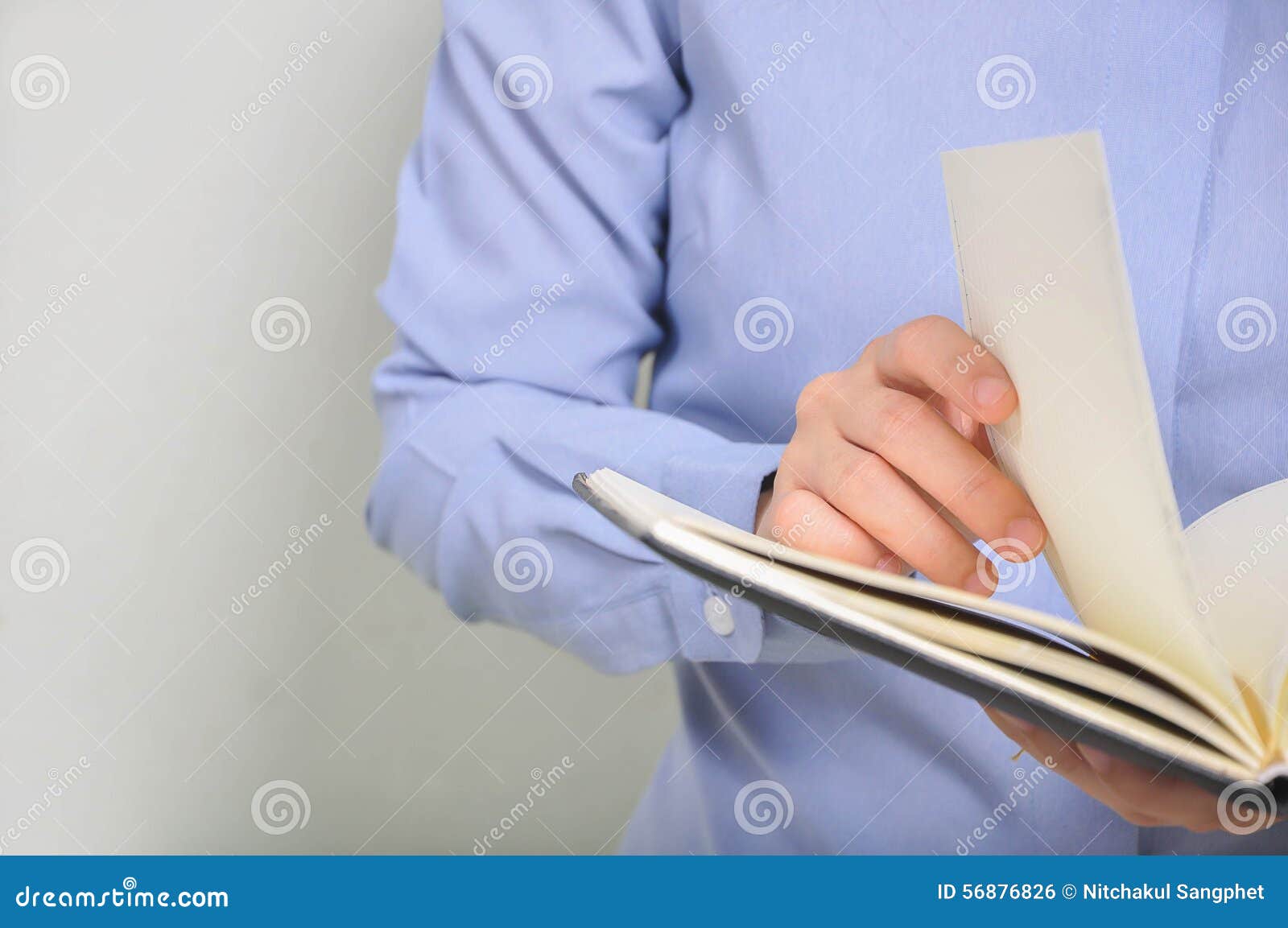 Hand opening books. stock photo. Image of learn, work - 56876826