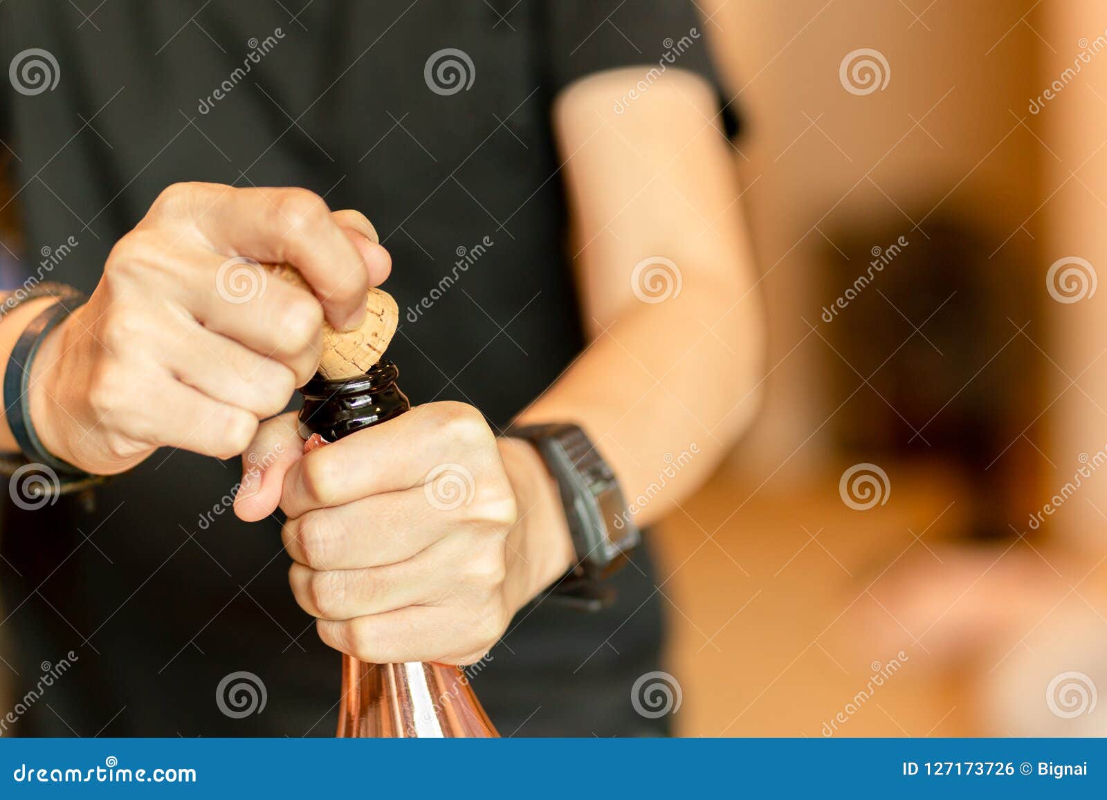 Hand Opening Bottle of Champagne for Celebration Indoor. Stock Photo ...