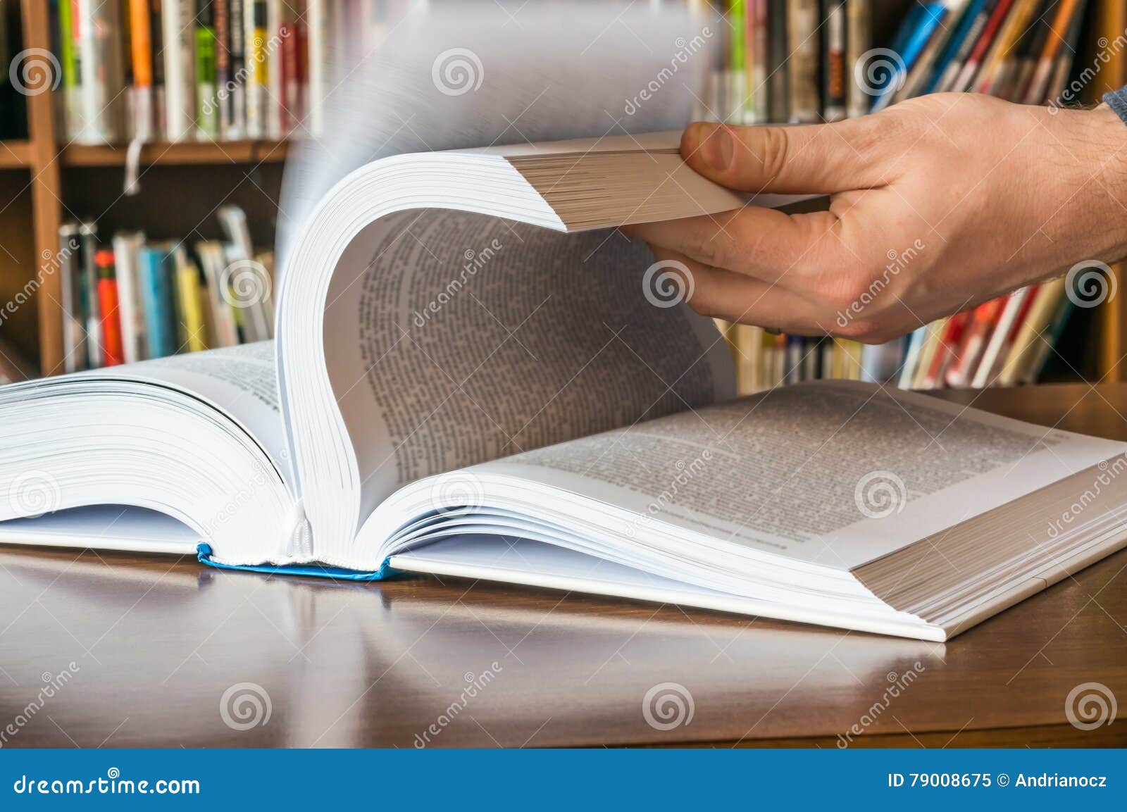 The Hand Opening and Browsing the Book Pages Stock Image - Image of ...