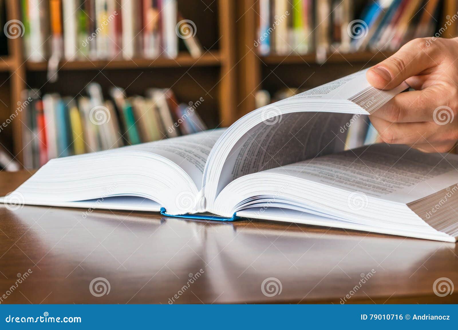 The Hand Opening and Browsing the Book Pages Stock Photo - Image of ...