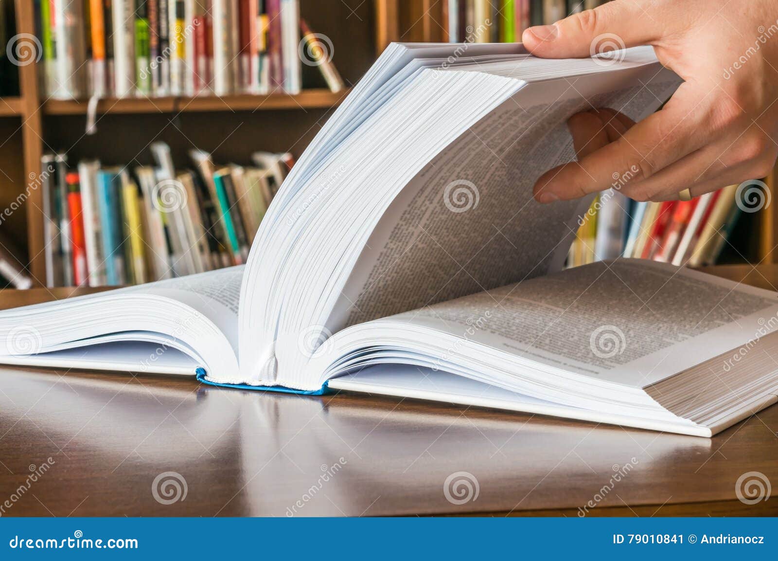 The Hand Opening and Browsing the Book Pages Stock Image - Image of ...