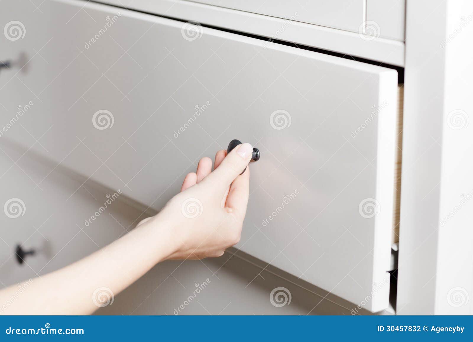 Hand opening a drawer stock photo. Image of closeup, wooden - 30457832