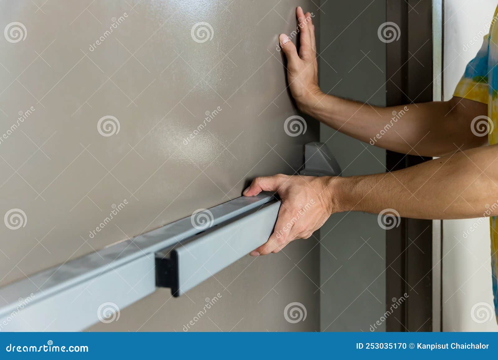 Hand Is Opening The Emergency Fire Exit Door. Emergency Fire Exit Door ...