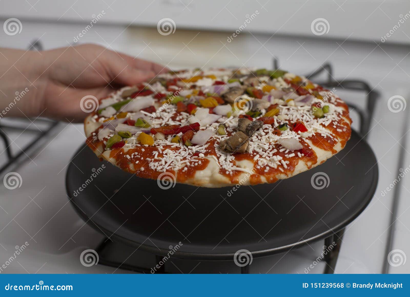 Hand Opening Frozen Pizza stock photo. Image of healthy - 151239568