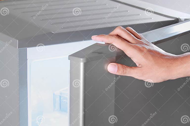 Hand opening refrigerator stock image. Image of clean - 21071371
