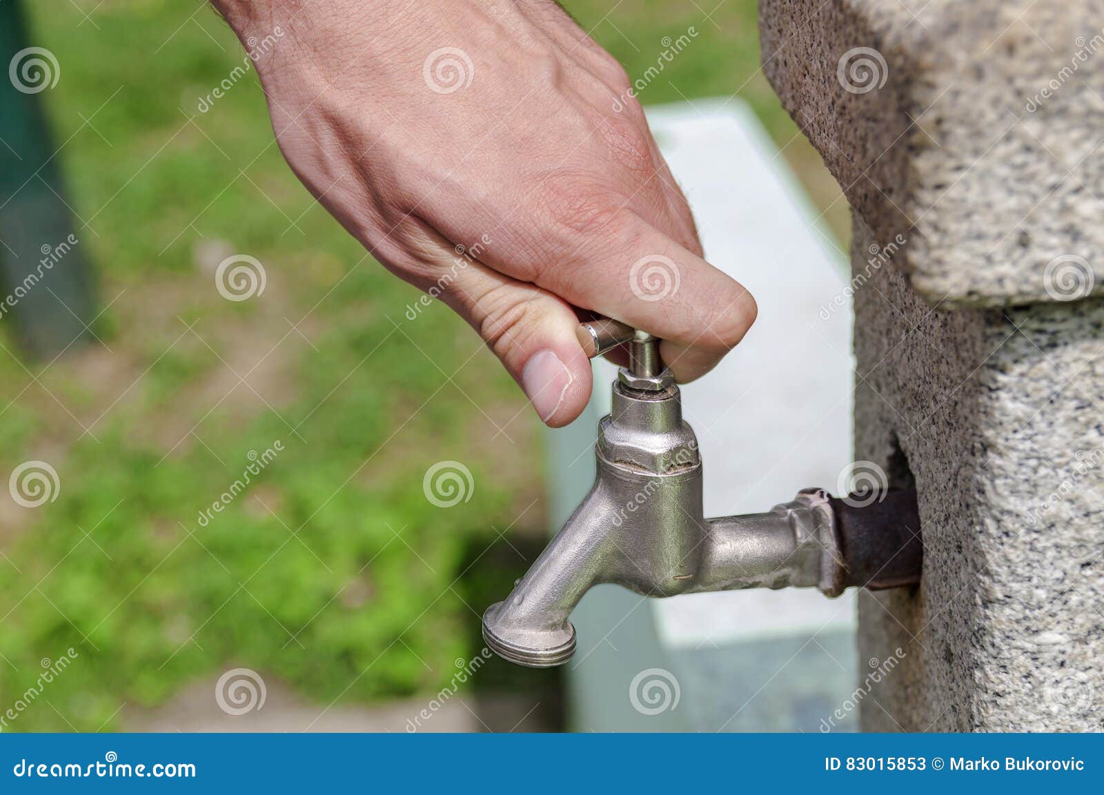 Hand Opening Water Drip from Water Tap in Park Stock Image - Image of ...