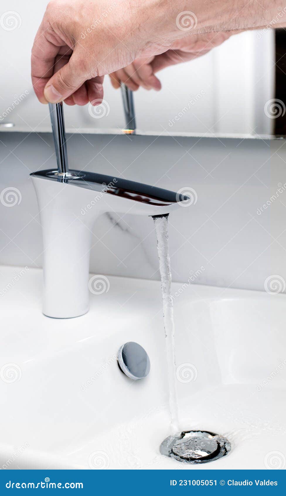 The Hand Opens the Tap To Let the Water Flow into the Sink Stock Image ...