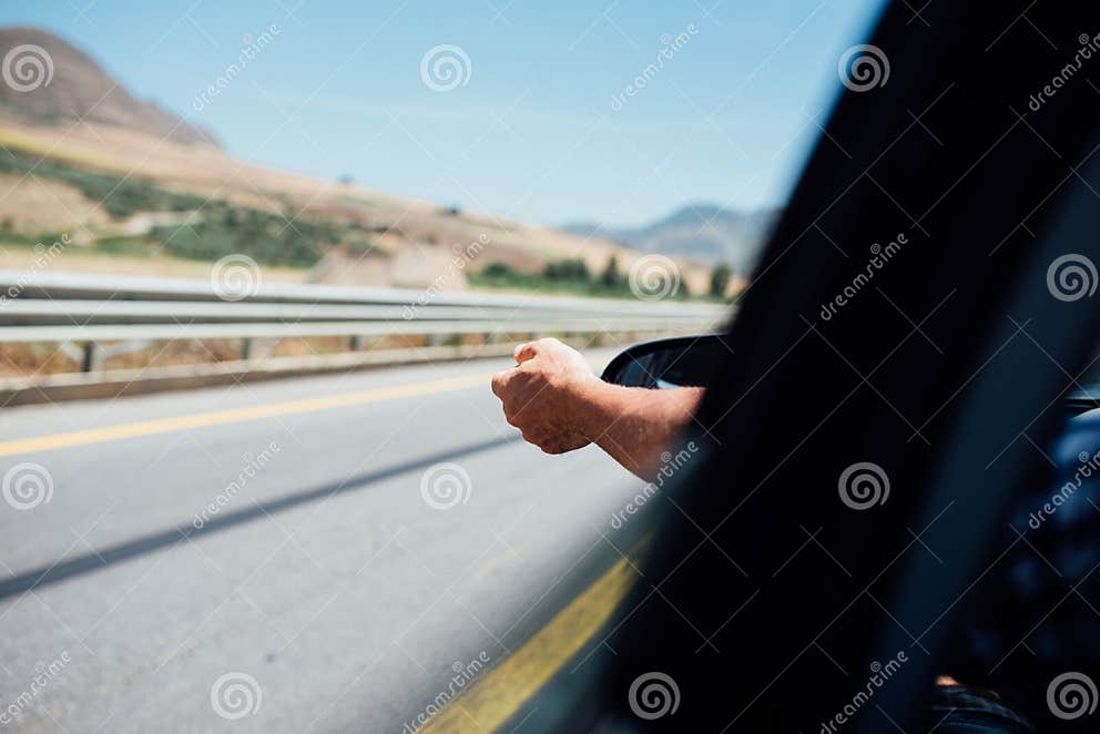 Hand out of car window stock image. Image of road, vehicle - 214153671