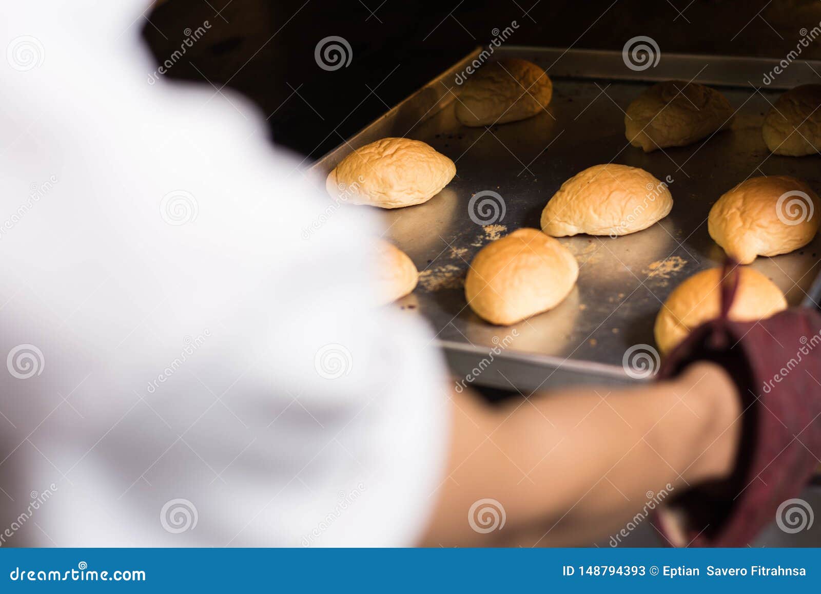 Zoom of Hand with Kitchen Glove Put or Take Bread from Inside Oven ...