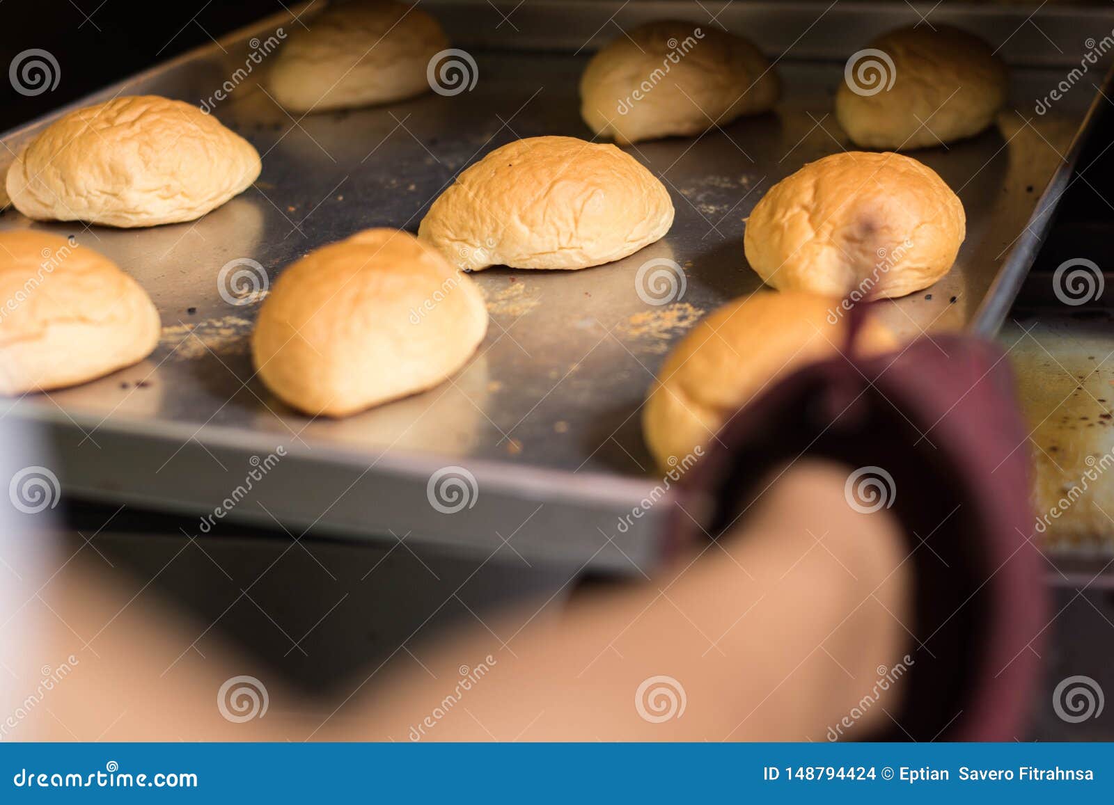 Zoom of Hand with Kitchen Glove Put or Take Bread from Inside Oven ...