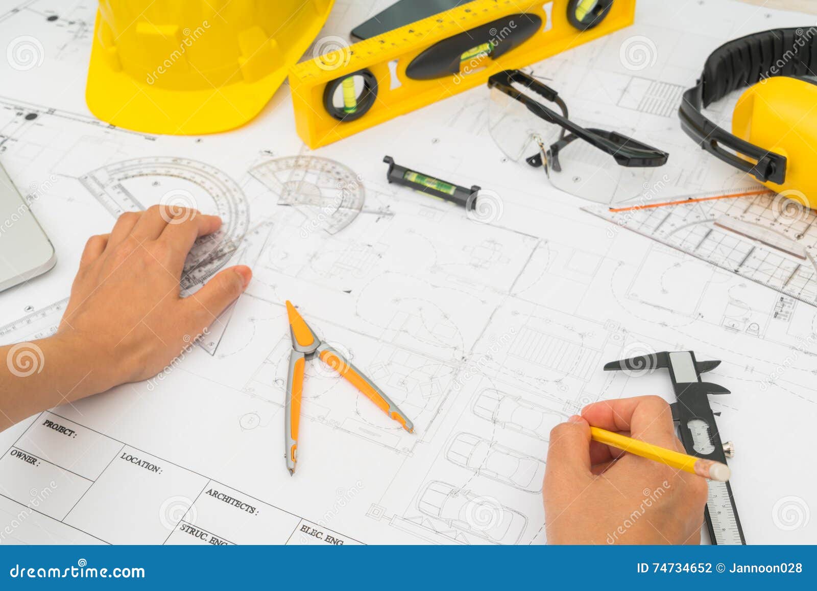 Hand Over Construction Plans with Yellow Helmet and Drawing Tool Stock ...