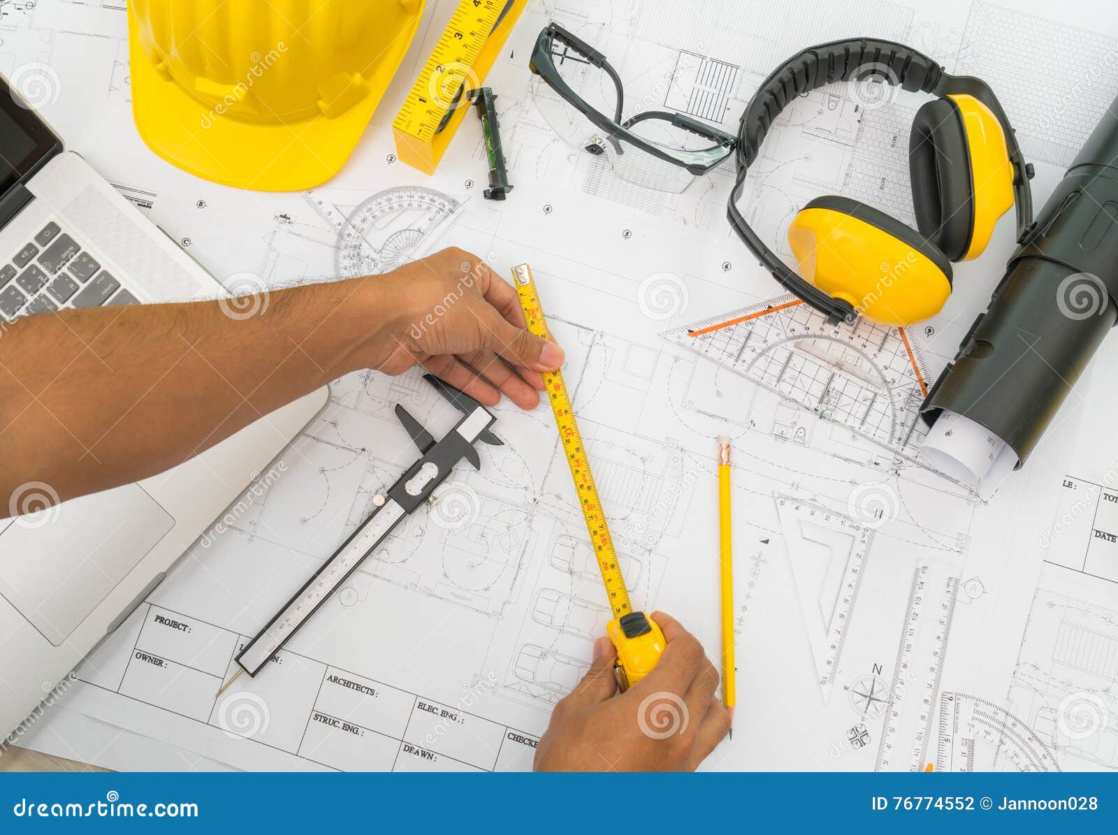Hand Over Construction Plans with Yellow Helmet and Drawing Tool Stock ...