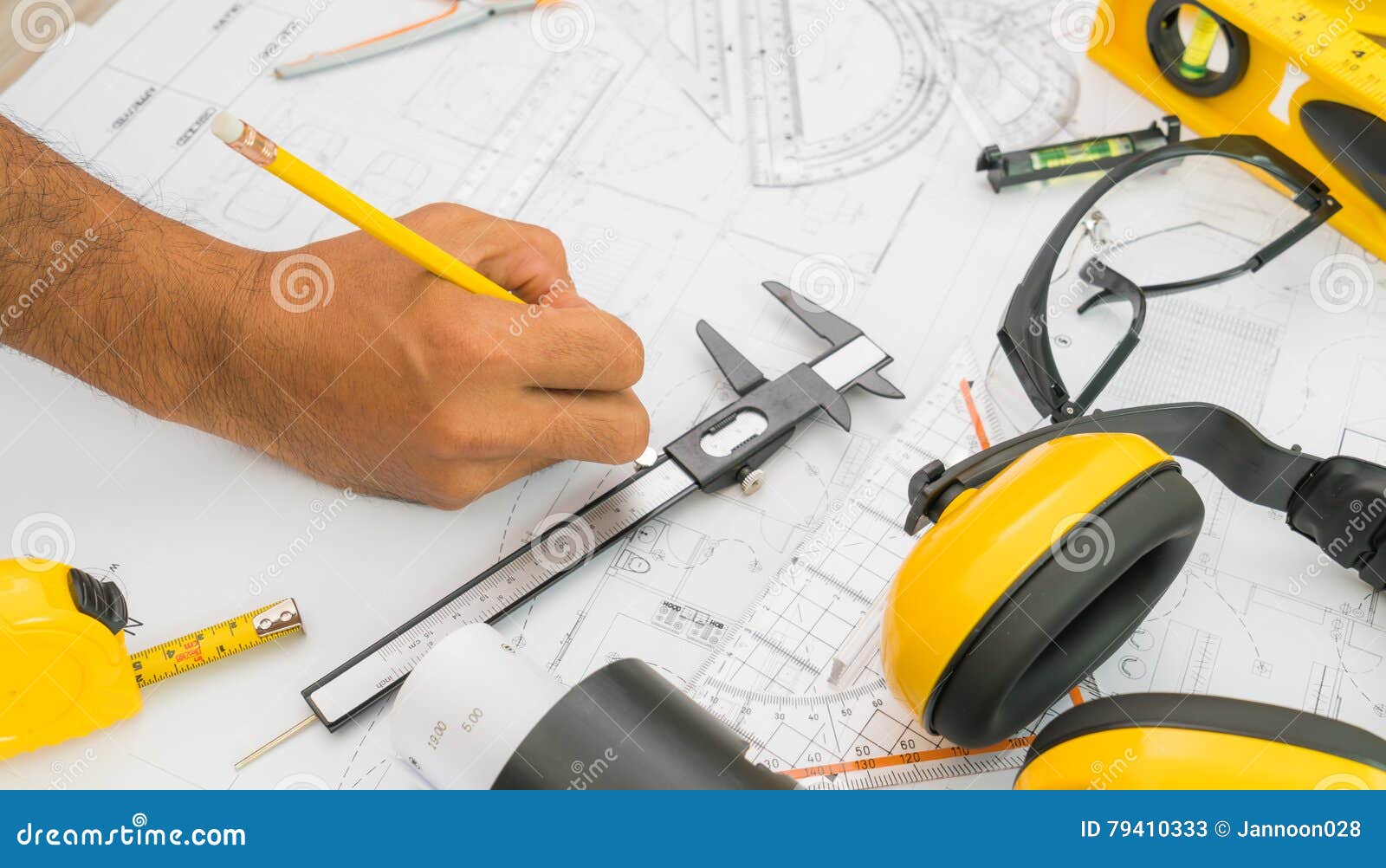 Hand Over Construction Plans with Yellow Helmet and Drawing Tool Stock ...