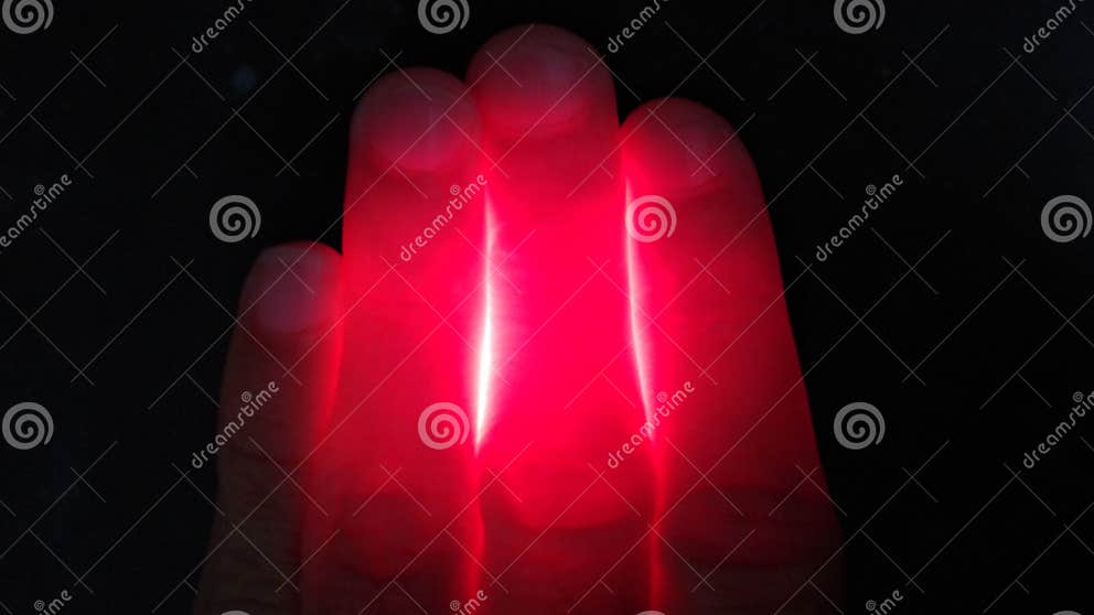 Hand Over Flashlight with Red Light Effect, Red Light Therapy Concept ...