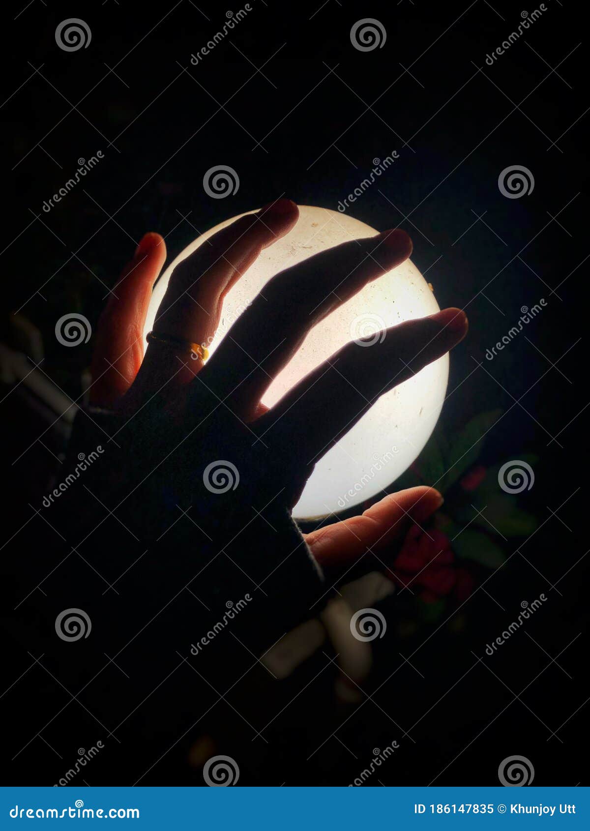 Hand over light stock image. Image of night, light, silhouette - 186147835