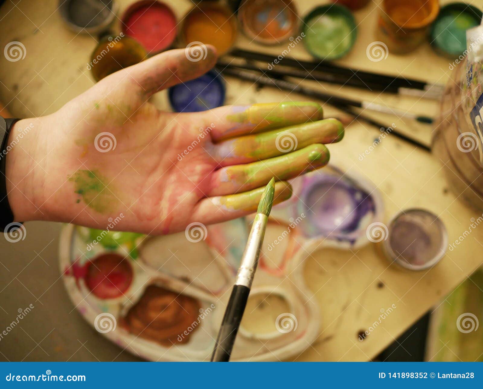 Hand in the Paint of an Art School Student on the Background of a ...