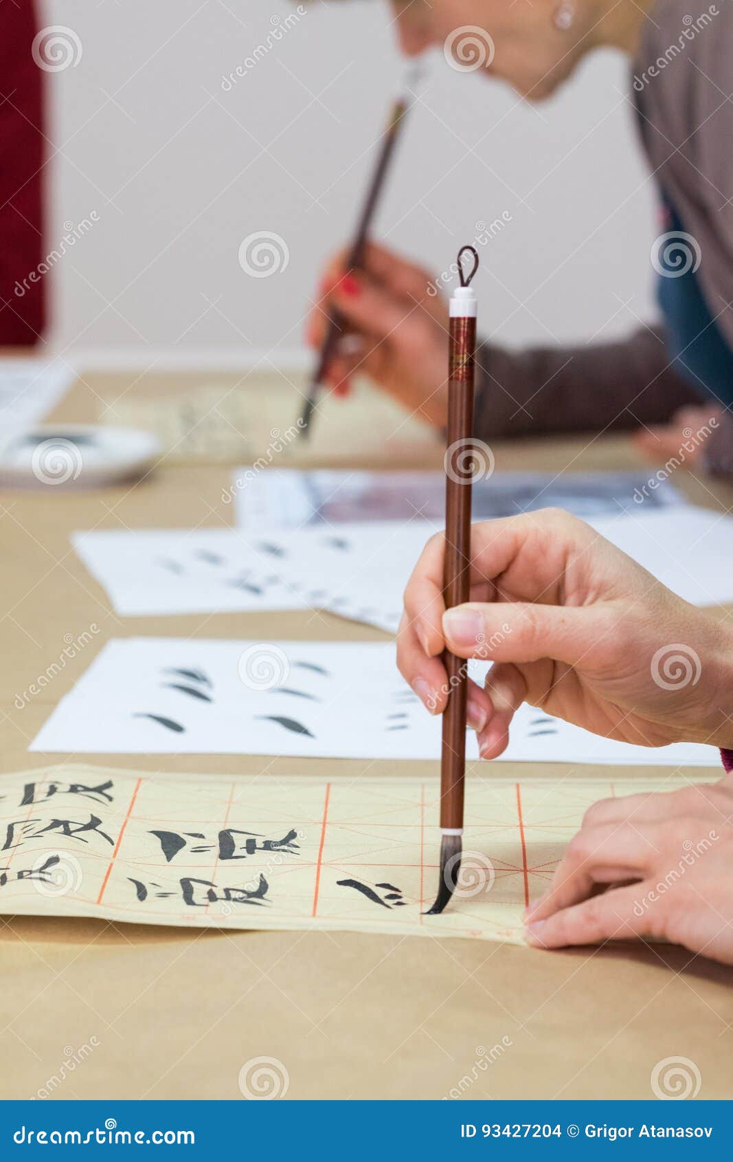Hand with Paint Brush Calligraphy Stock Photo - Image of calligraphy ...