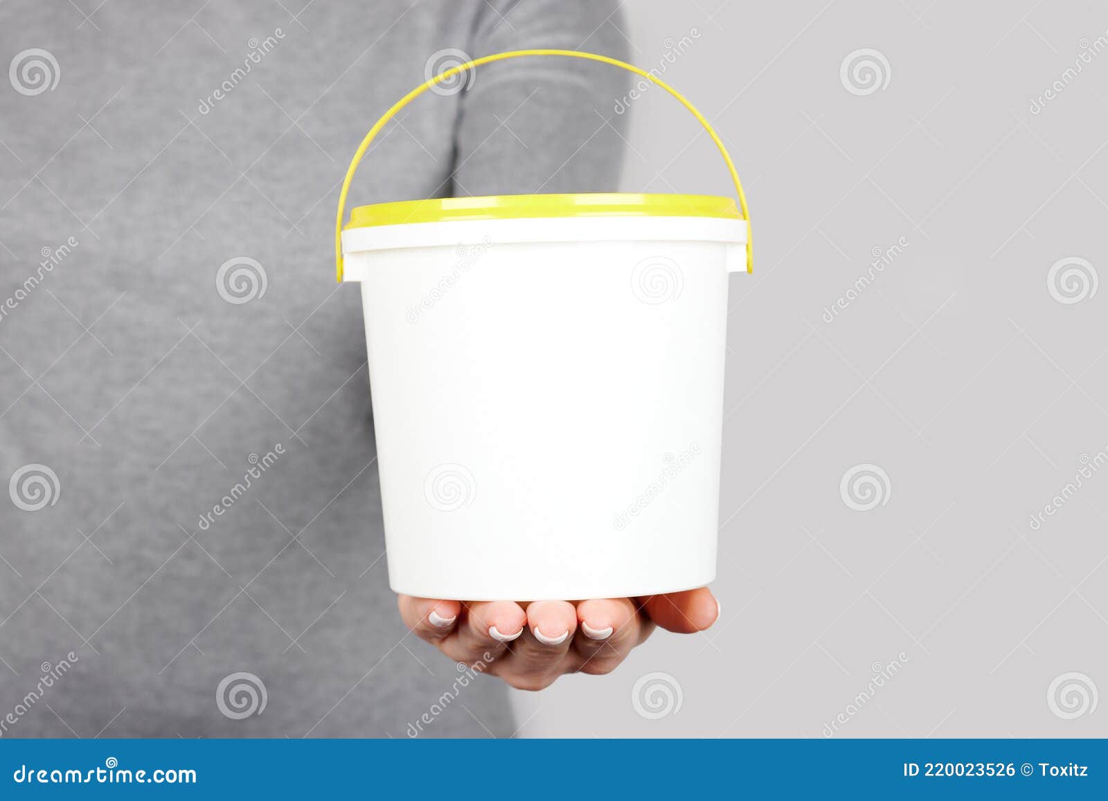 Hand with Paint Bucket on Grey Background Stock Photo - Image of pail ...