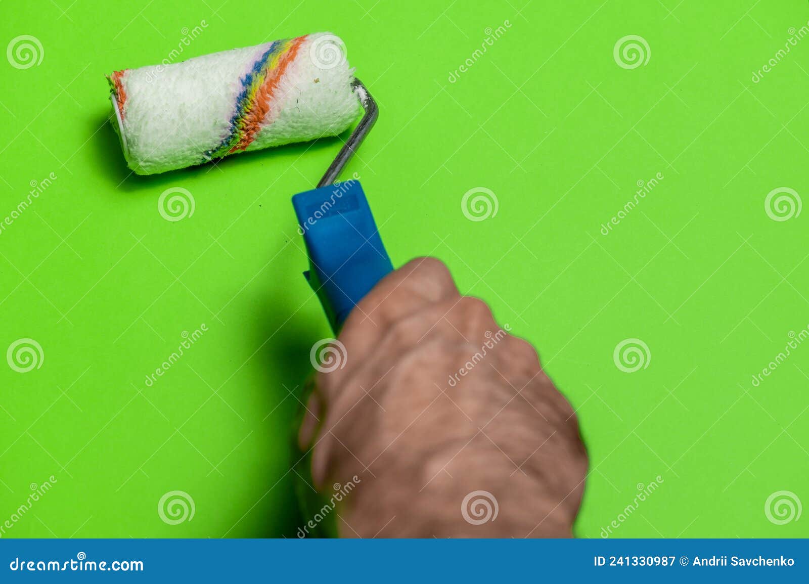Hand with Paint Roller on Green Wall Stock Image - Image of artistic ...
