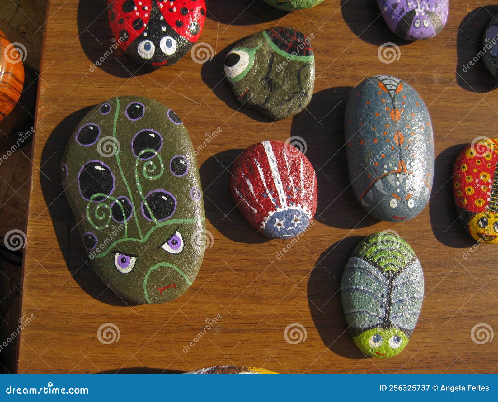 Painted Bug Rocks on Table stock image. Image of look - 256325737