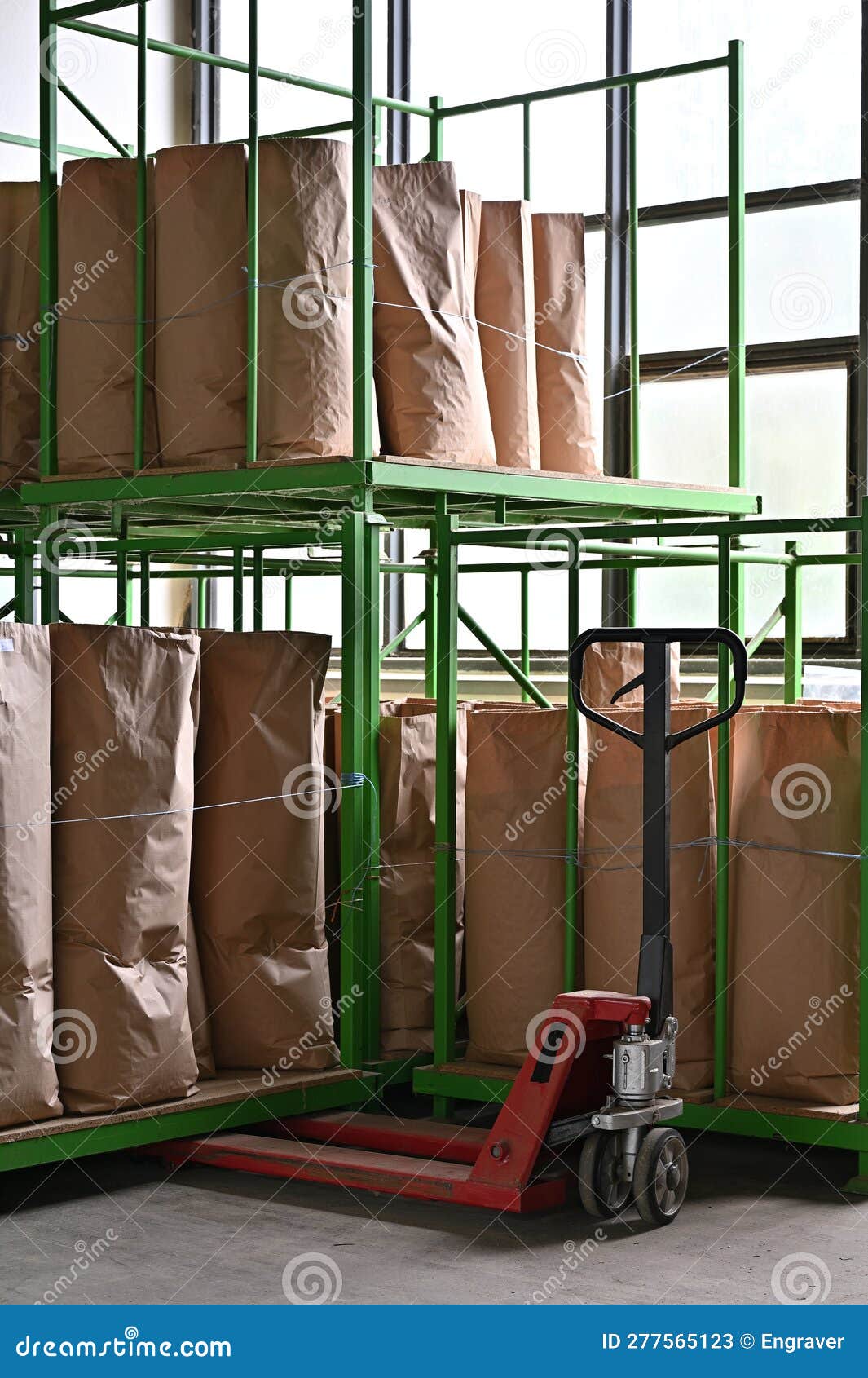 Hand Pallet Jack With Stacked Of Package Boxes On Pallet Rack Waiting ...