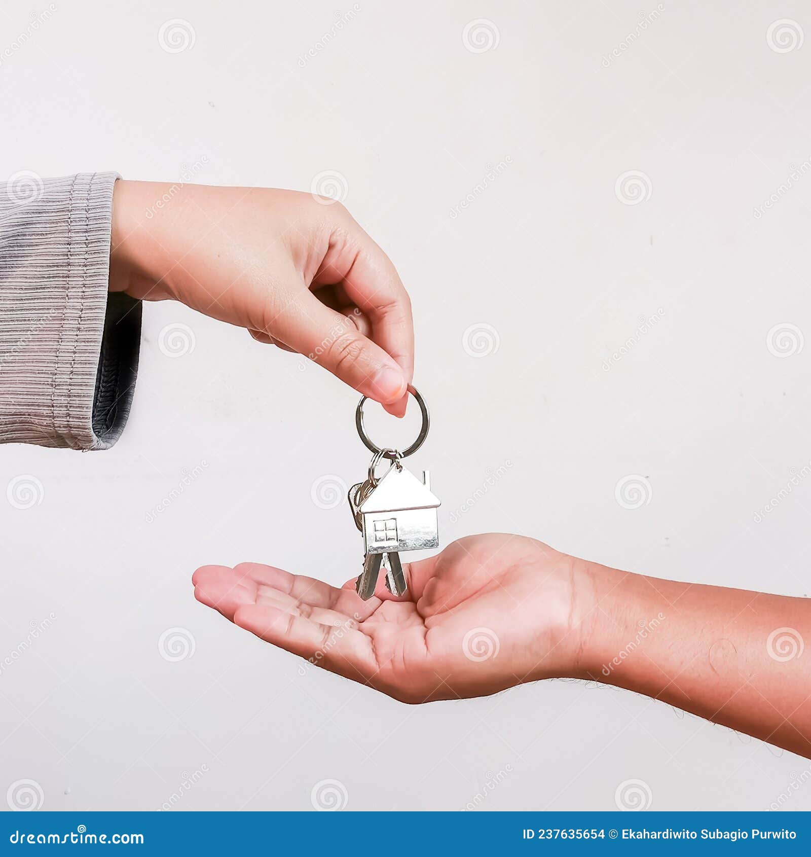 Hand Passing a Set of House Keys To Another Hand. Stock Photo - Image ...